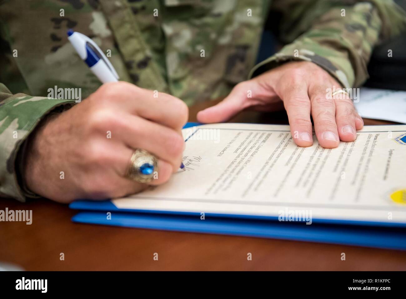 Col. Michael Miller, 2nd Bomb Wing commander, signs a proclamation ...