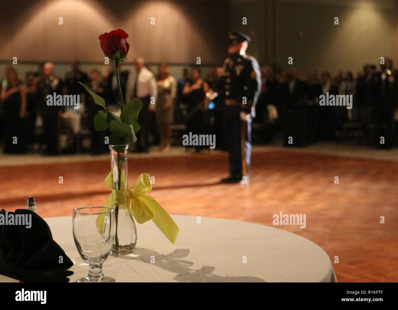 The non-commissioned officer in charge of a color guard renders a ...