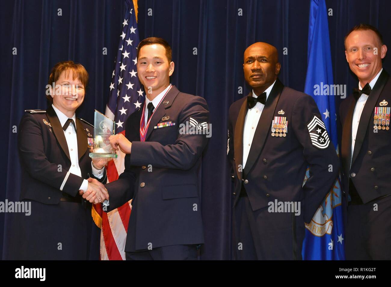 Col. Jennifer Grant, 50th Space Wing commander, presents Senior Airman ...