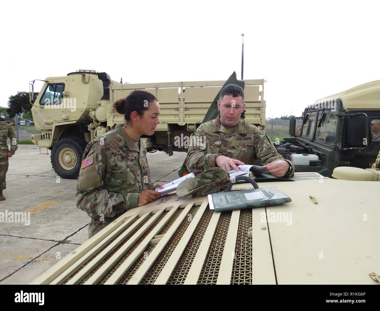 U.S Army Reserve Sgt. Richard Washburn shows Cadet Sheri Dyana Ortiz ...