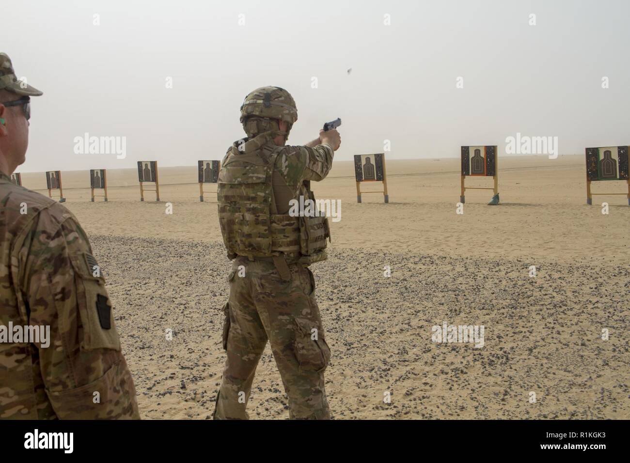 A Soldier fires an M9 Pistol as part of the German Armed Forces Badge ...
