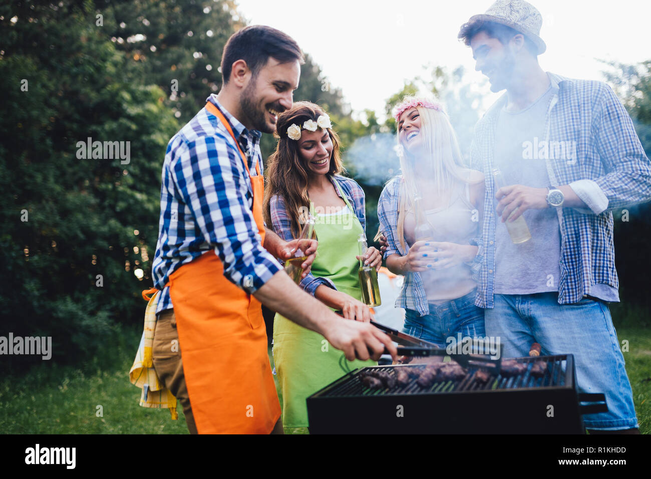 Female cooking barbecue hi-res stock photography and images - Alamy