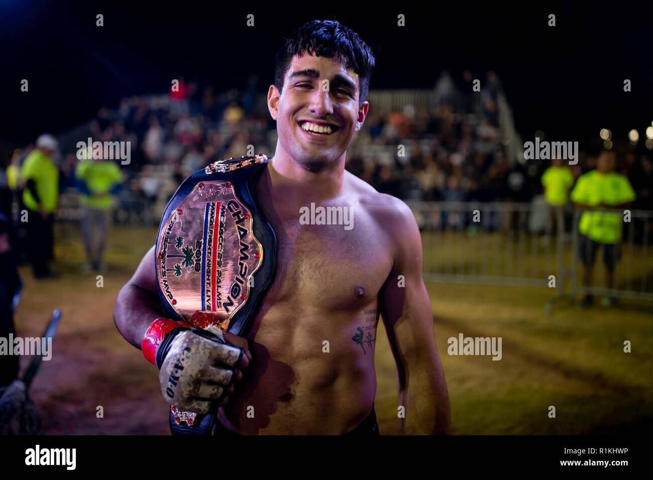 Ryan “The Lion” Fathi holds his championship belt at Del Valle Field ...