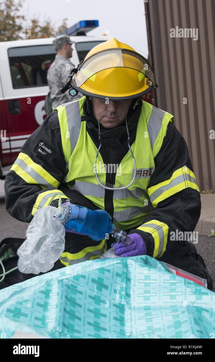 A firefighter, from 423rd Civil Engineer Squadron, tends to simulated ...