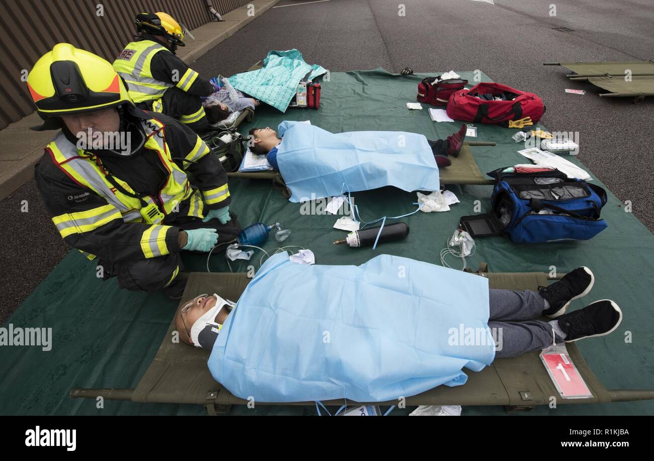 Firefighters, with the 423rd Civil Engineer Squadron, respond to ...