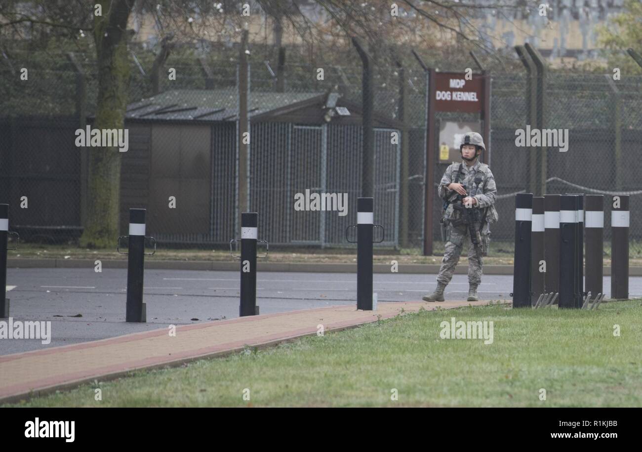 A Defender, with the 423rd Security Forces Squadron, tends to a ...