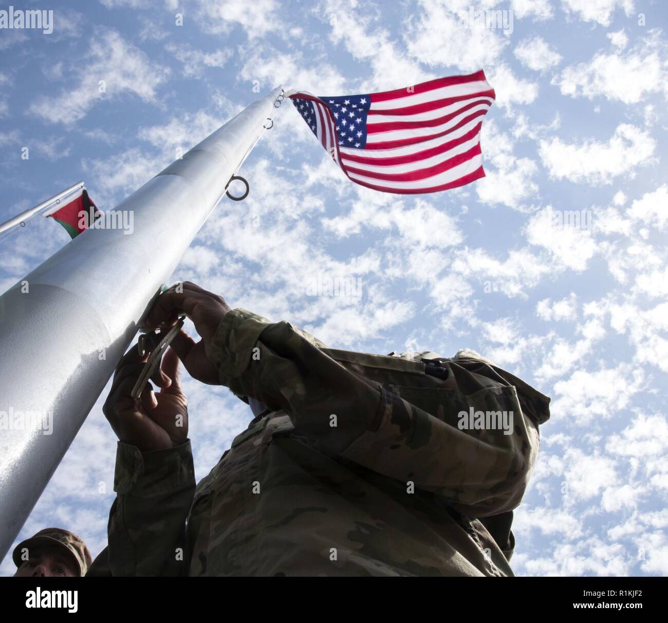 Soldier raises american flag hi-res stock photography and images - Alamy