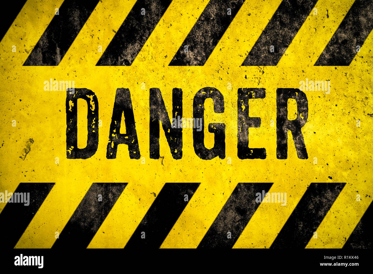 DANGER warning sign word text as stencil with yellow and black stripes ...