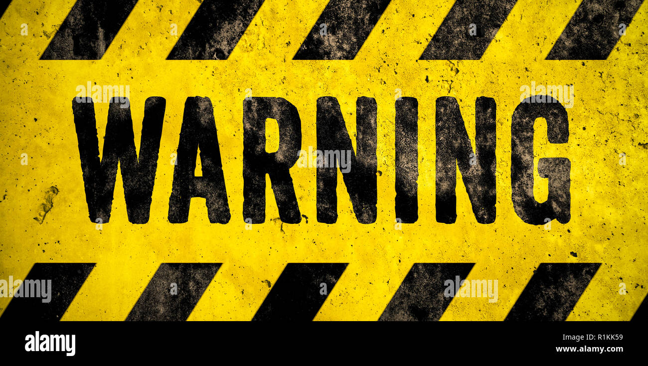 WARNING danger sign word text as stencil with yellow and black stripes ...