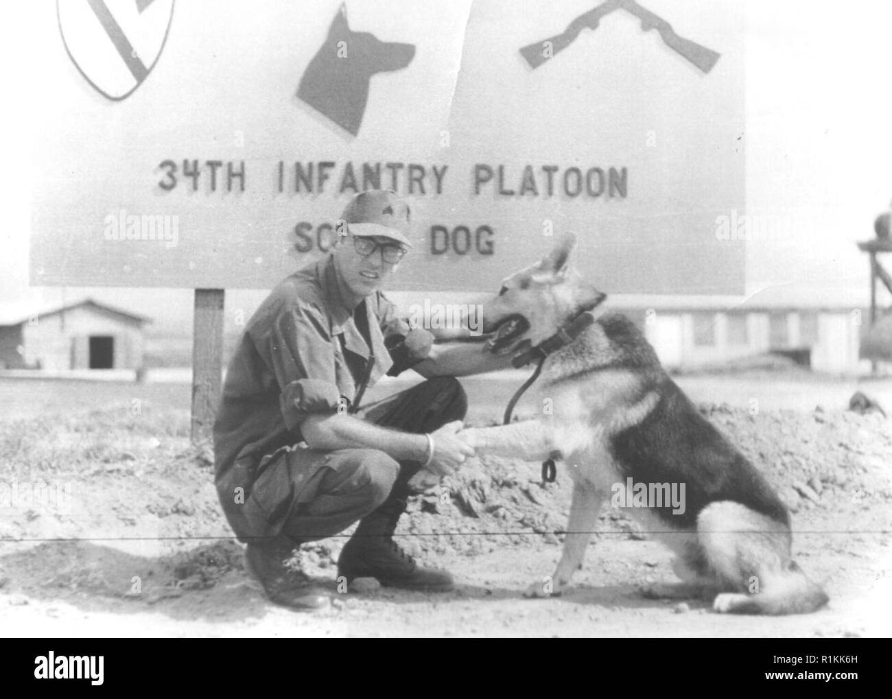 Jerry Shirley, with his scout dog, Jack, in front of their unit, the ...