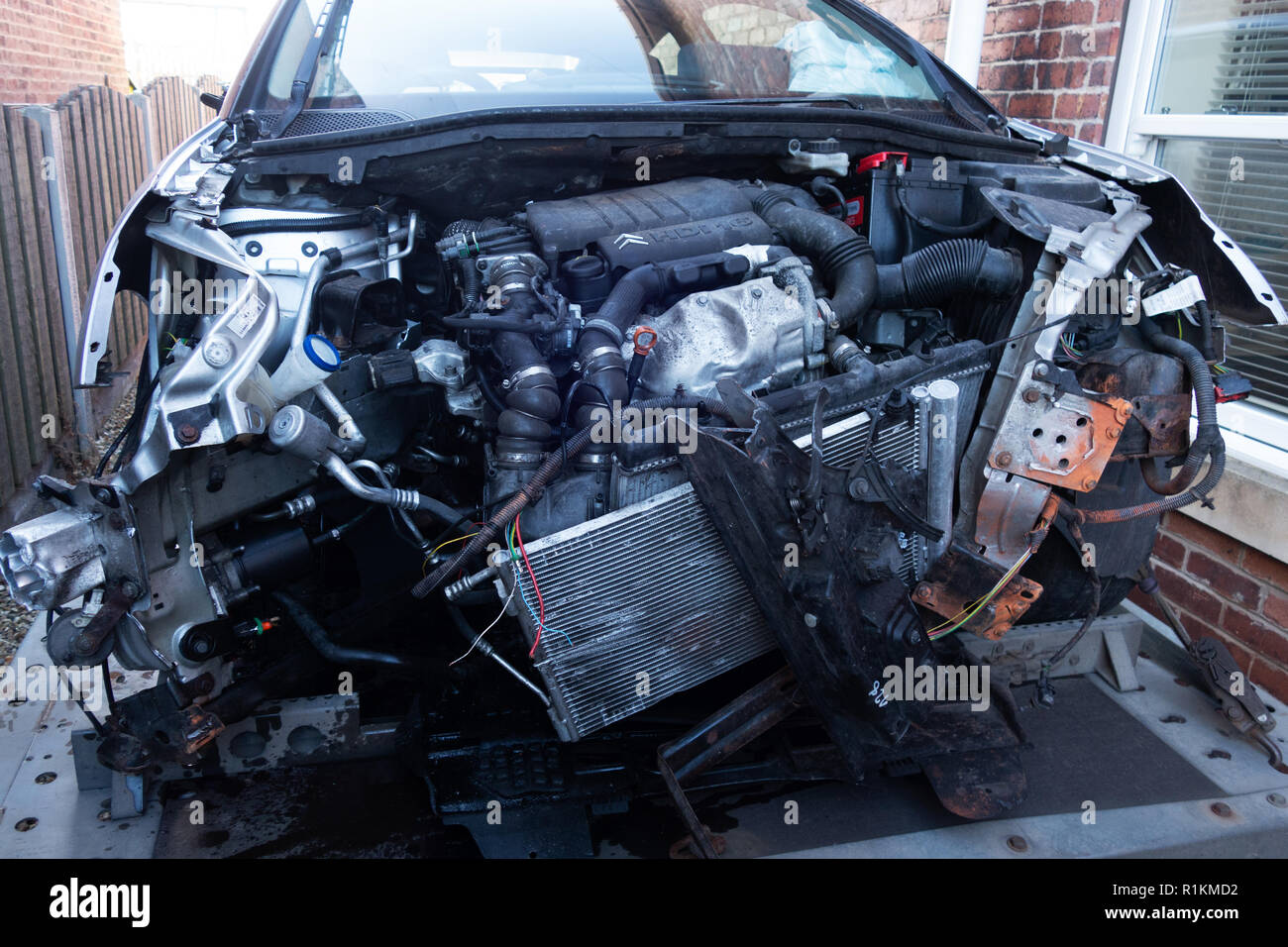 Engine and engine bay and written off front end in crash damaged ...