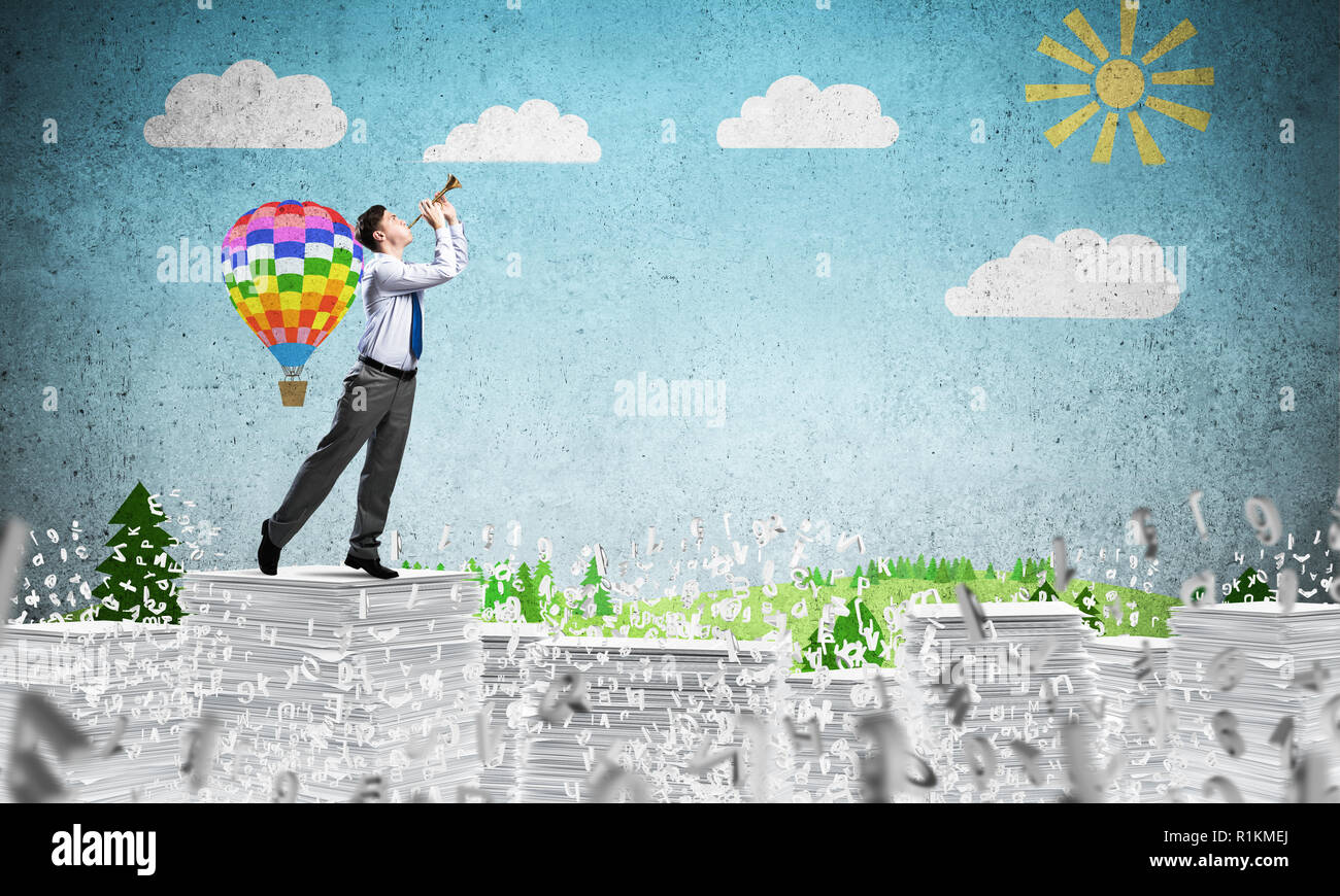 Happy businessman playing fife Stock Photo - Alamy