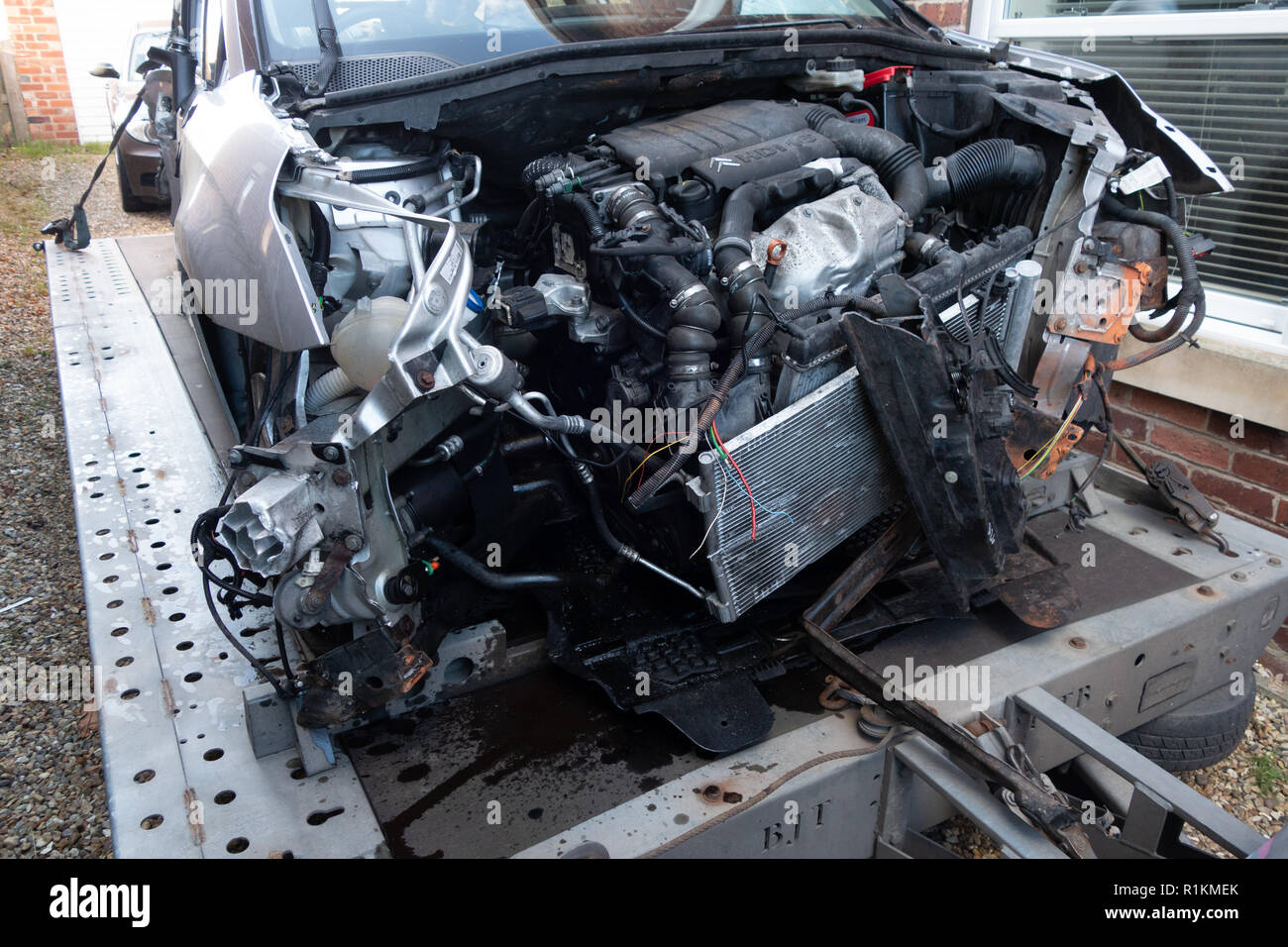 Engine and engine bay and written off front end in crash damaged ...