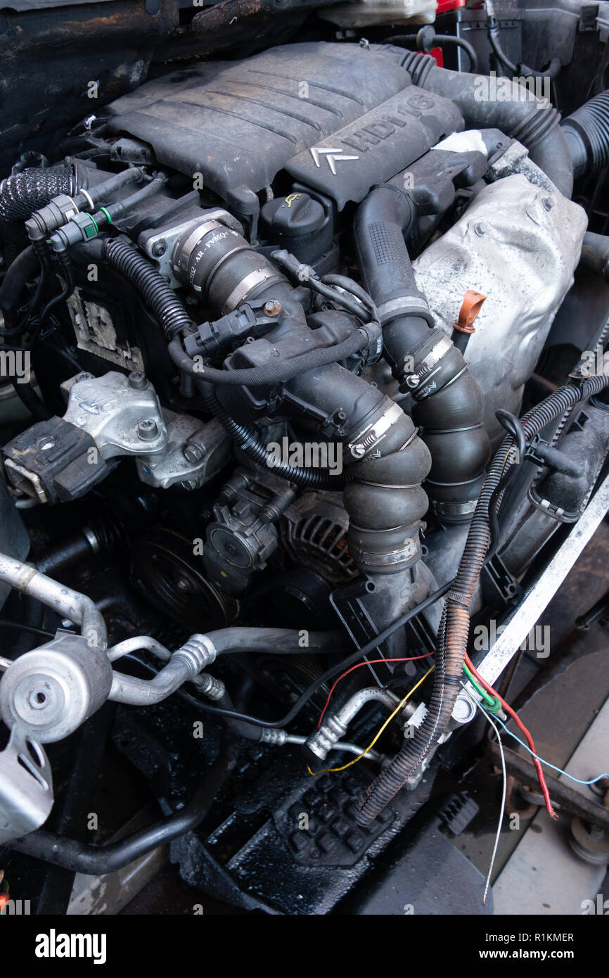 Engine and engine bay and written off front end in crash damaged ...