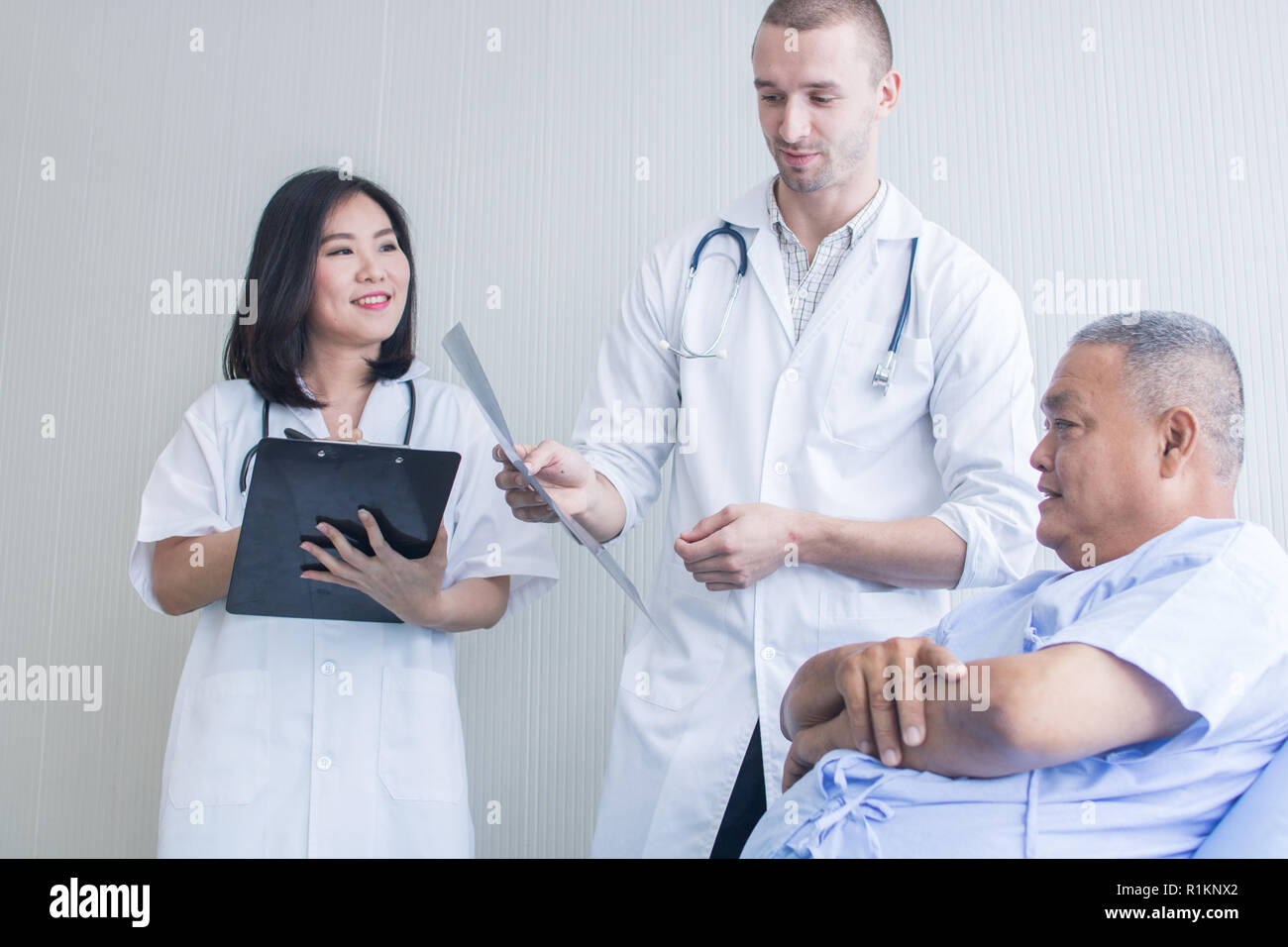 Healthcare and medical people concept, doctor looking on X-ray film of ...