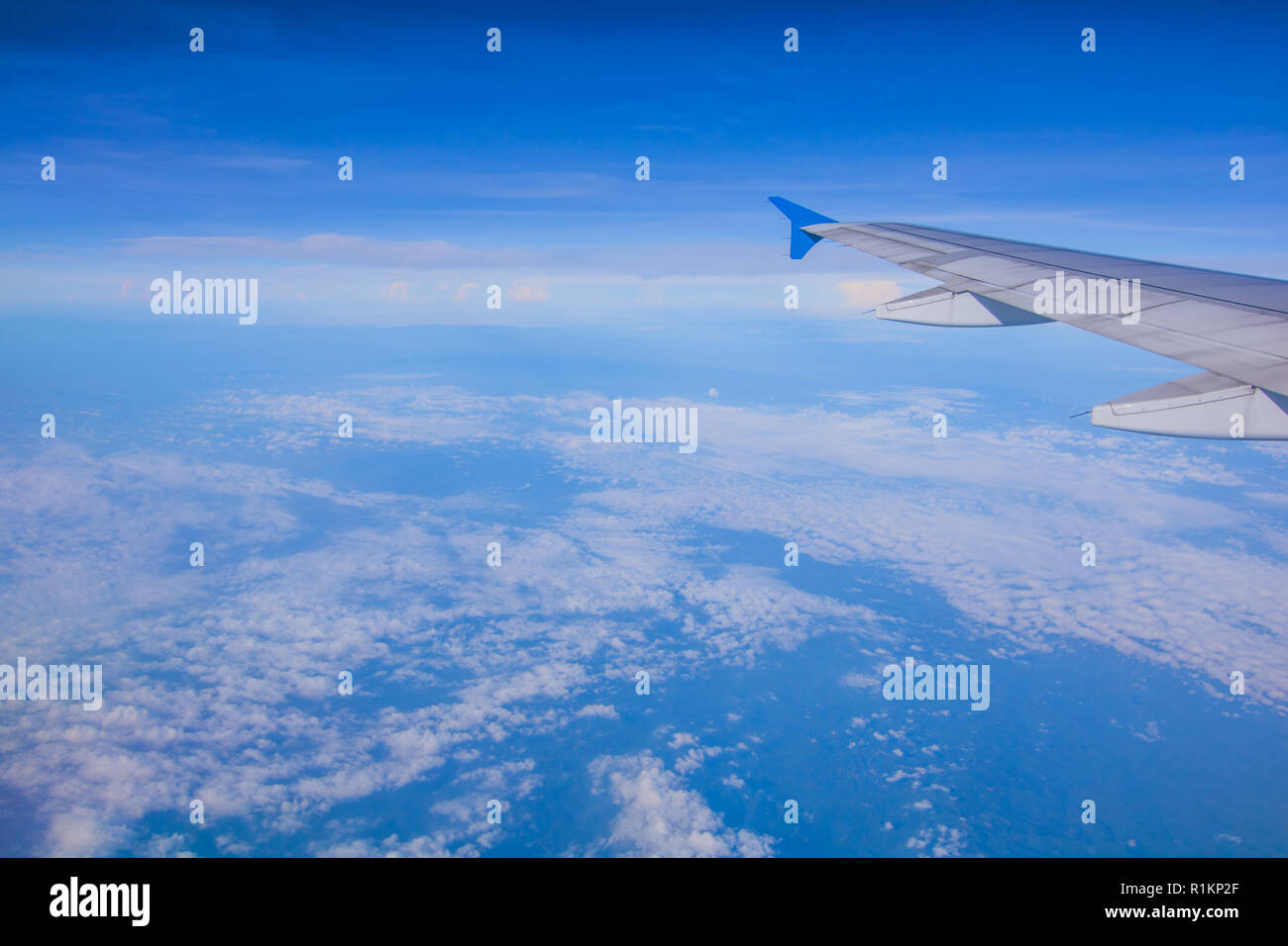 top view blue sky with wing of airplane Stock Photo - Alamy