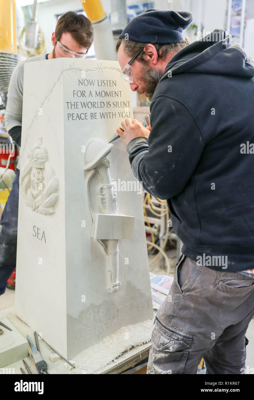 Stone masons from Salisbury cathedral work on a war memorial in their ...