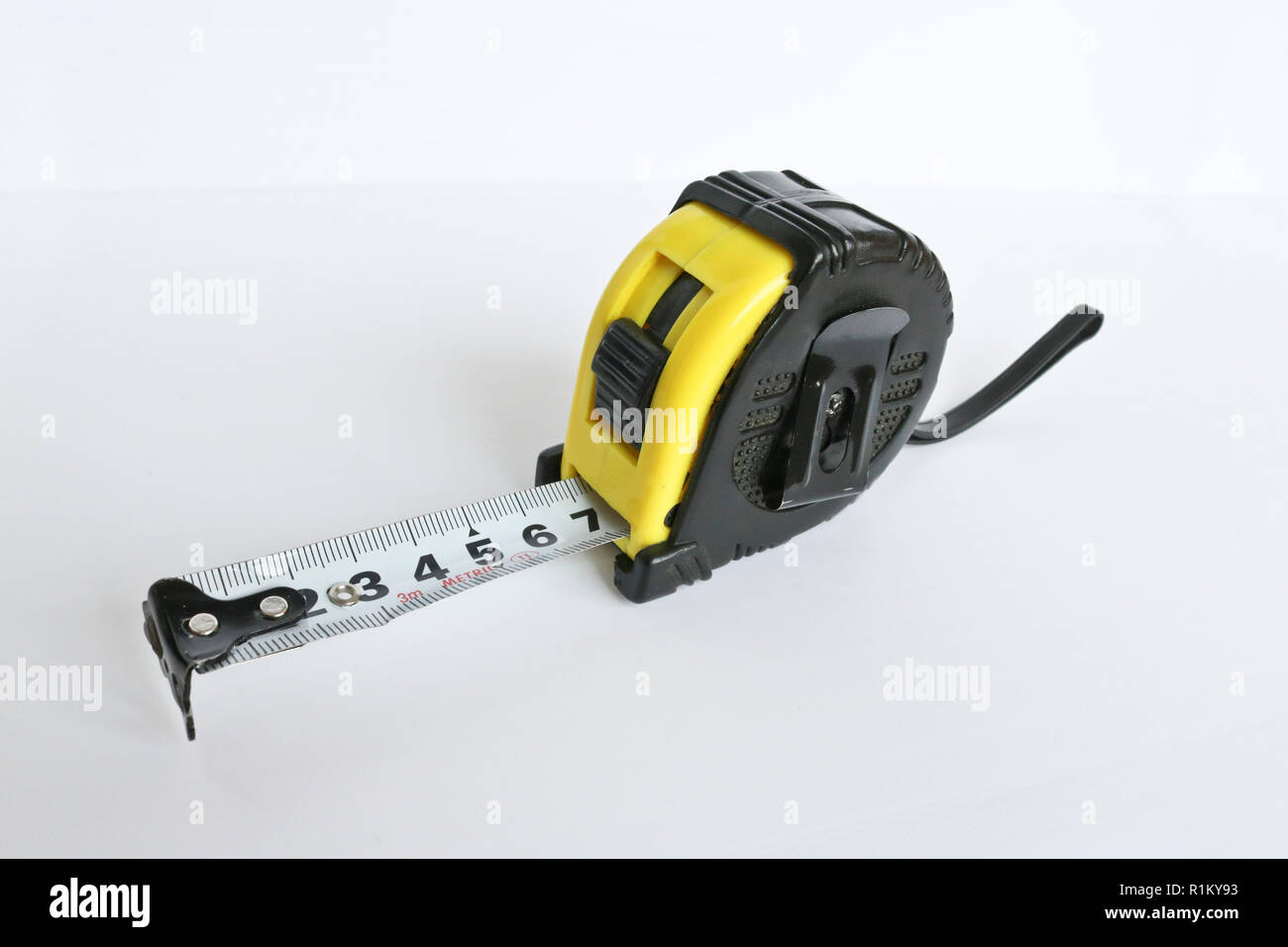 Construction tape measure - an isolated object on a light background ...