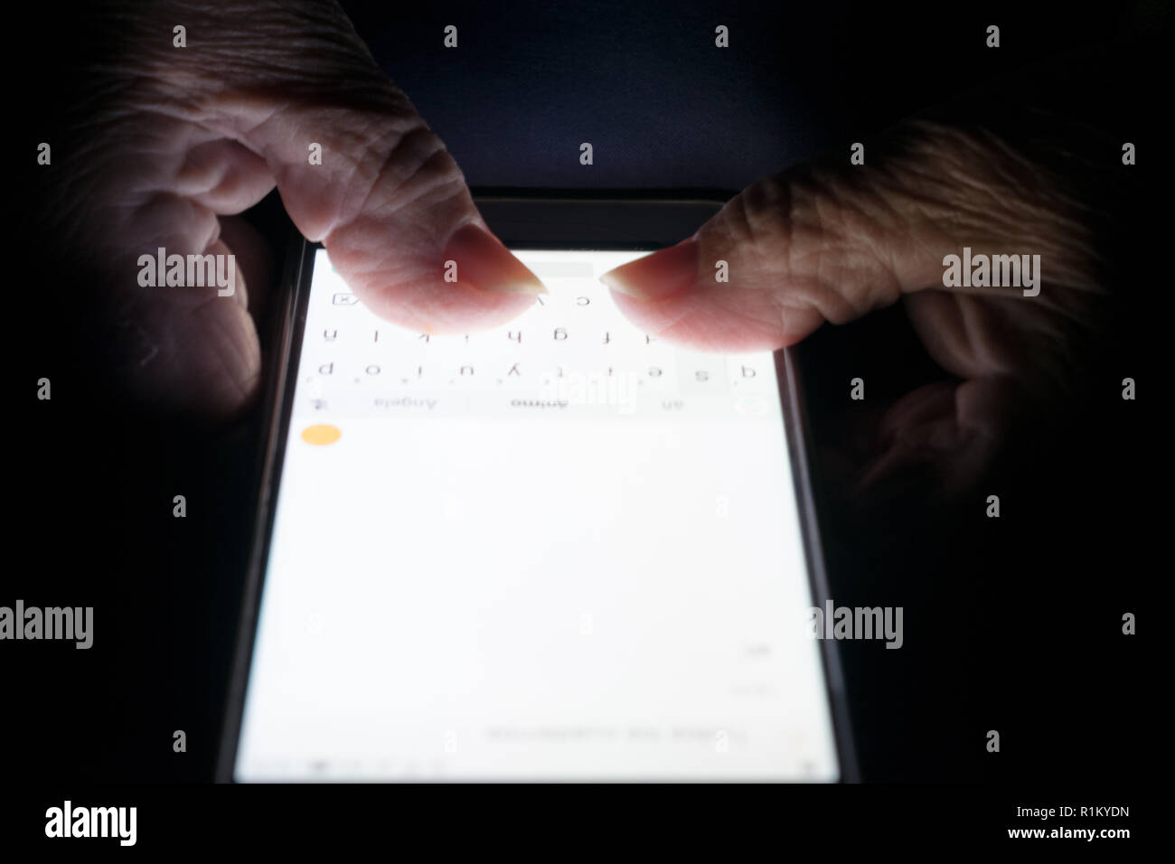 Senior person touching the screen of a smartphone Stock Photo - Alamy