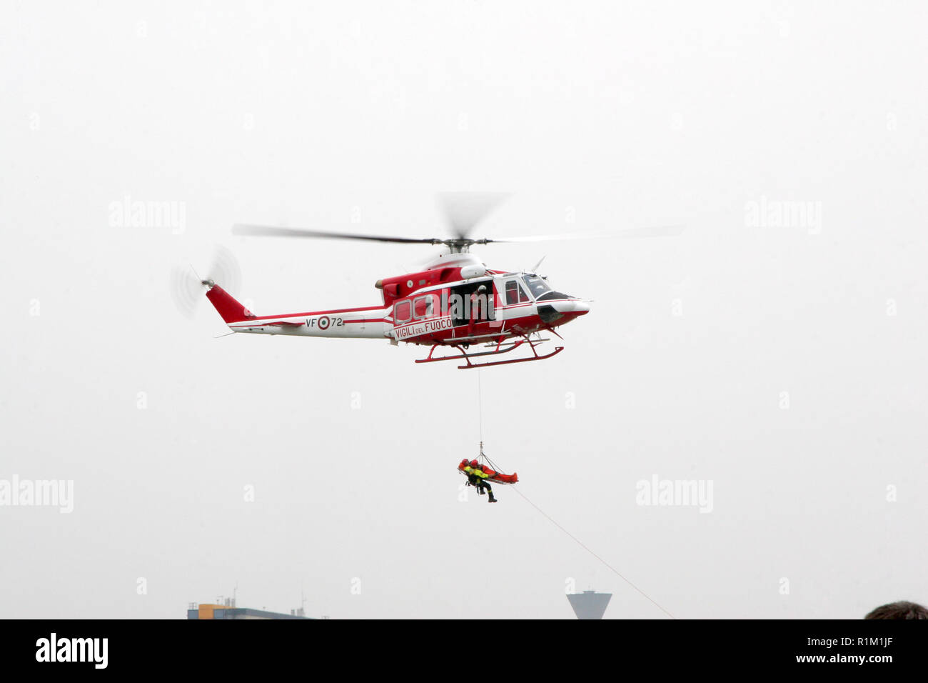 Fire brigade helicopter during a rescue operation Stock Photo - Alamy