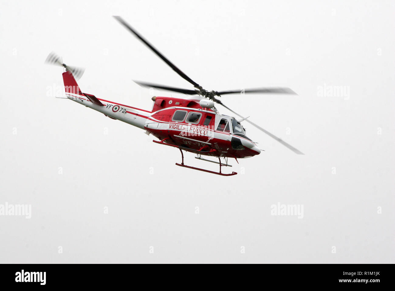Fire brigade helicopter during a rescue operation Stock Photo - Alamy