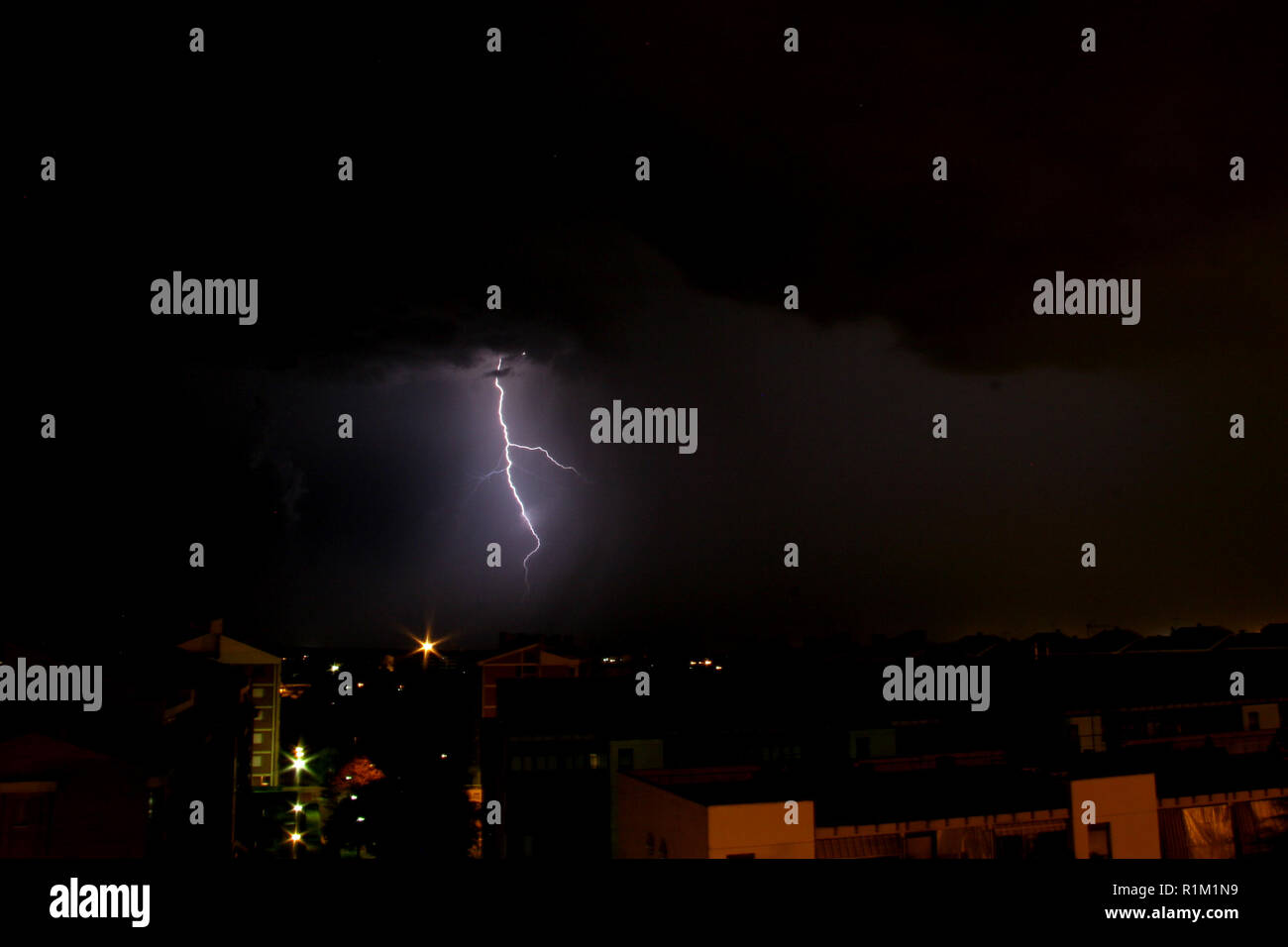 Lightning during a thunderstorm Stock Photo - Alamy