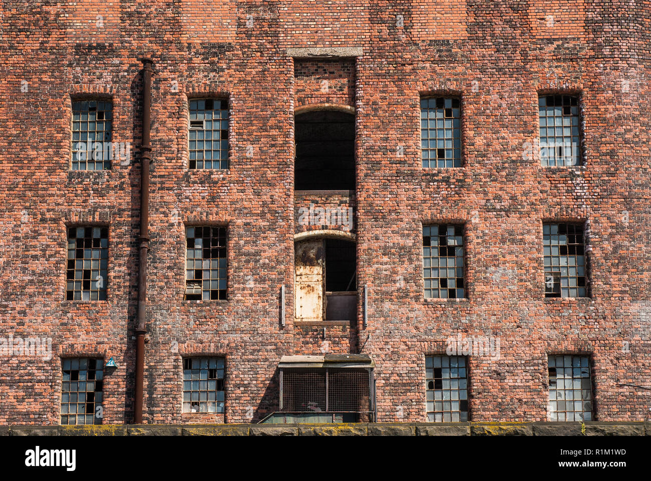 Old derelict brick industrial historical warehouse at Liverpool docks ...