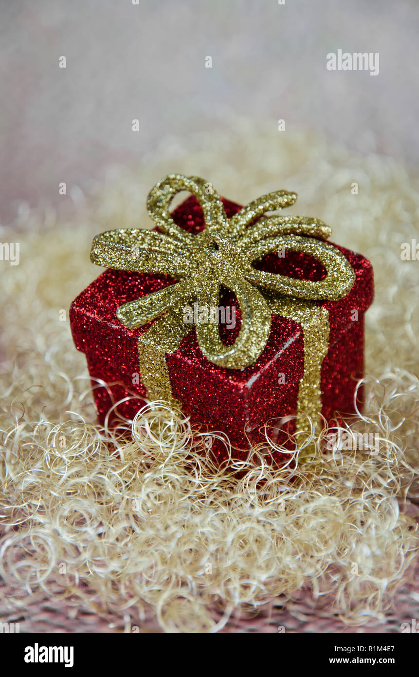 simple red christmas box with surprise inside in golden background ...