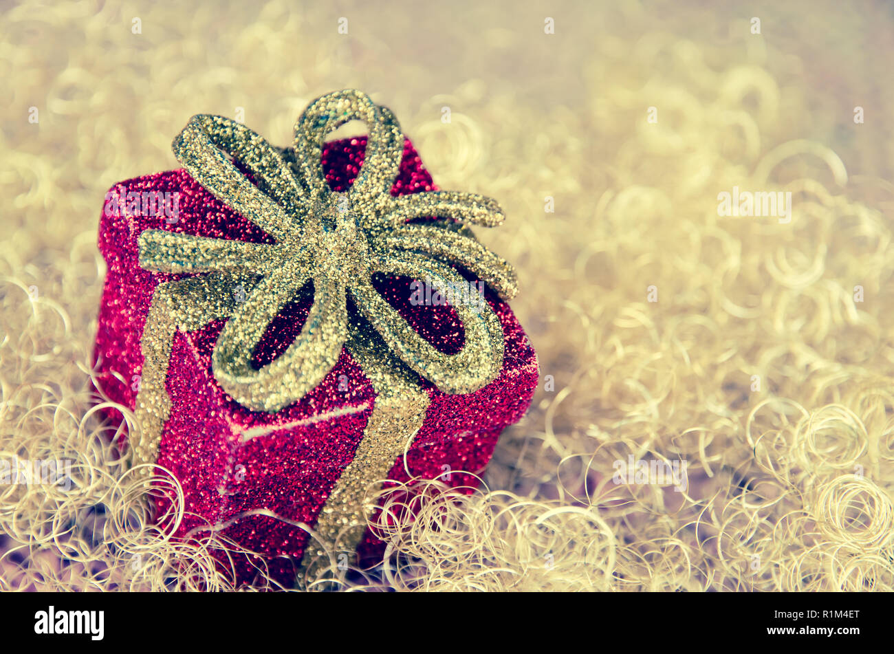 shining red christmas box with surprise inside in golden background ...