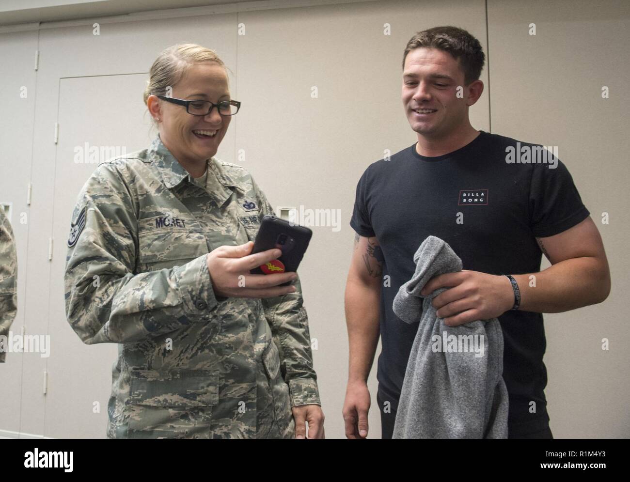 U.S. Air Force Staff Sgt. Mikenzie Moret, left, shows Josh Eldridge a ...