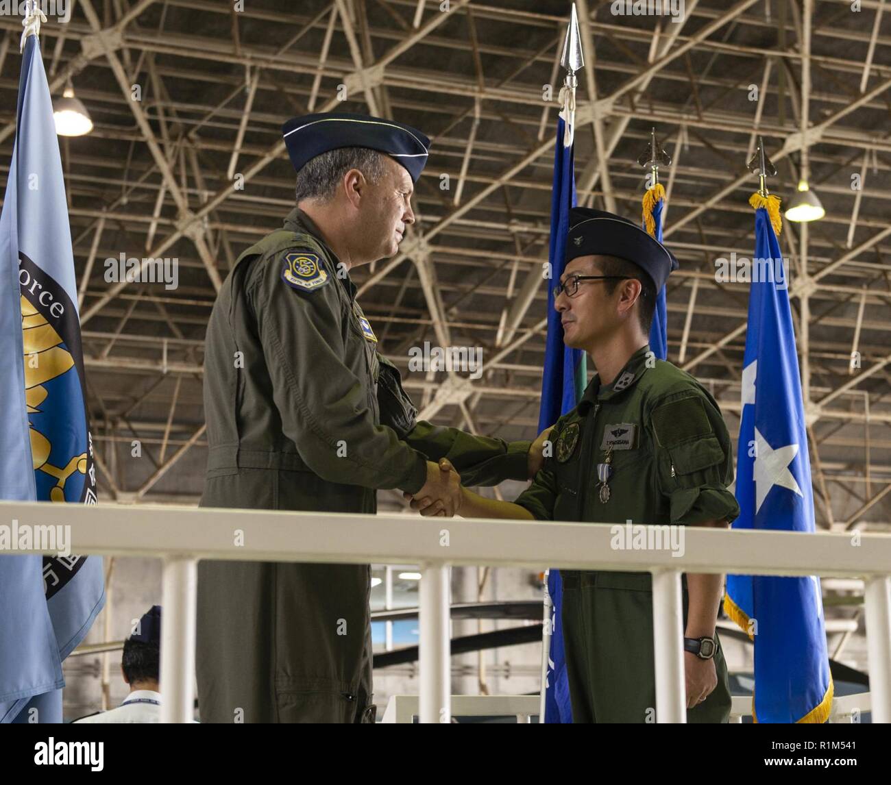 Lt. Gen. Jerry Martinez, U.S. Forces, Japan, commander, presents a U.S ...
