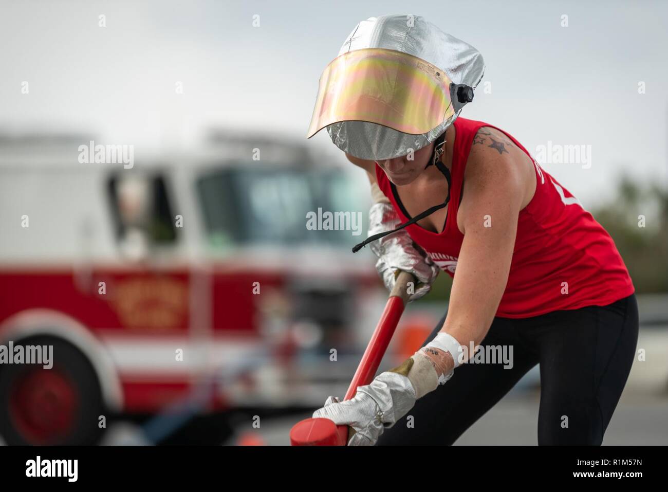 A participant swings a sledge hammer during the 2018 Fire Muster Oct ...