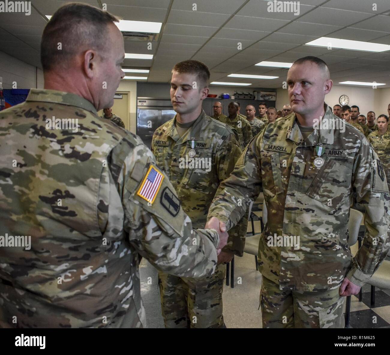 The National Guard Lifesaving Medal is presented to Sgt. Tyge Nelson ...