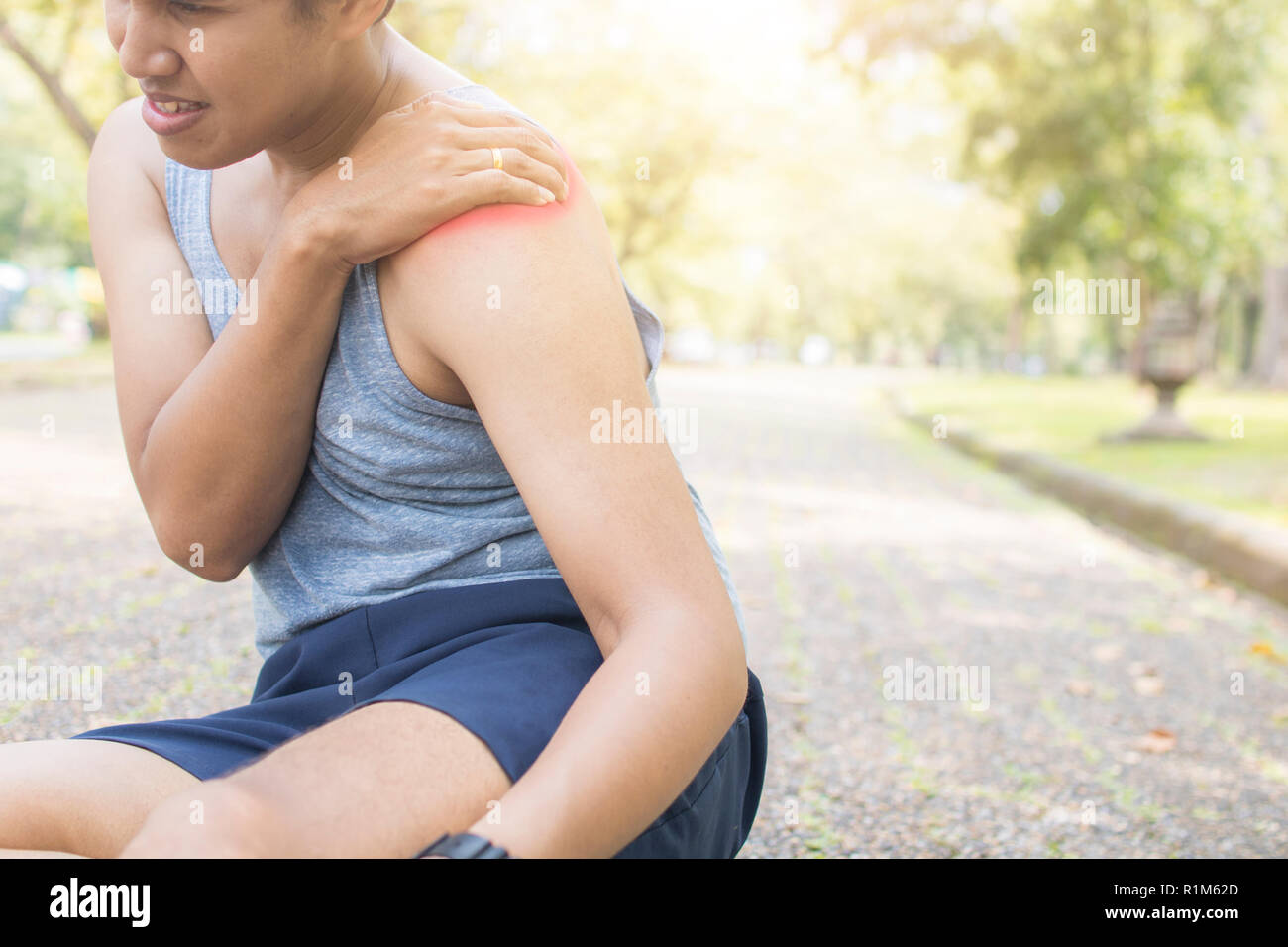 sport people has shoulder injury after running and work out in morning ...