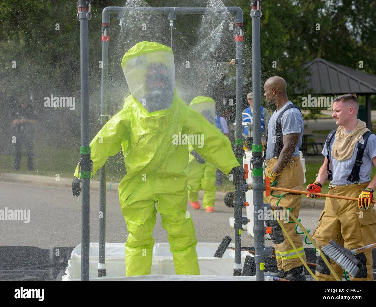 Keesler firefighters go through the decontamination site during the ...