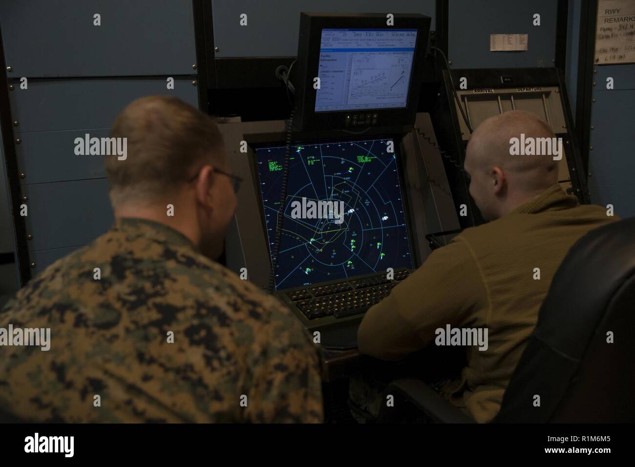 U.S. Marine Corps Cpl. Kevin Rigdon, (left), and Cpl. Mark Bailey, air ...