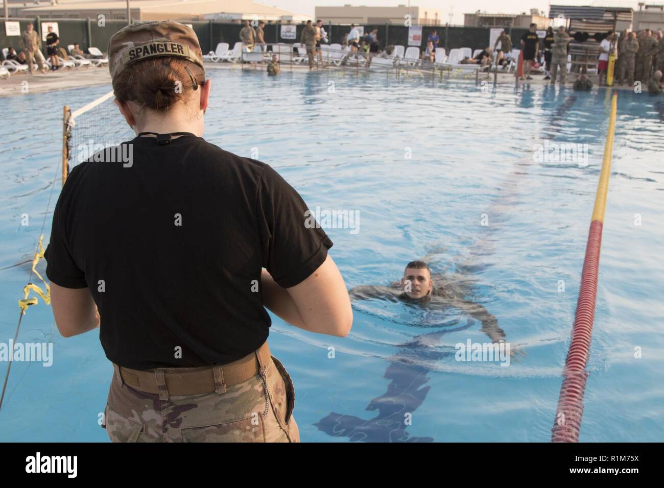 A U.S. Army Soldier listens to a grader call out his time after he ...