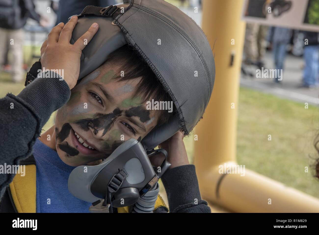 An attendee tries on a joint mounted cueing system helmet at Draughon ...