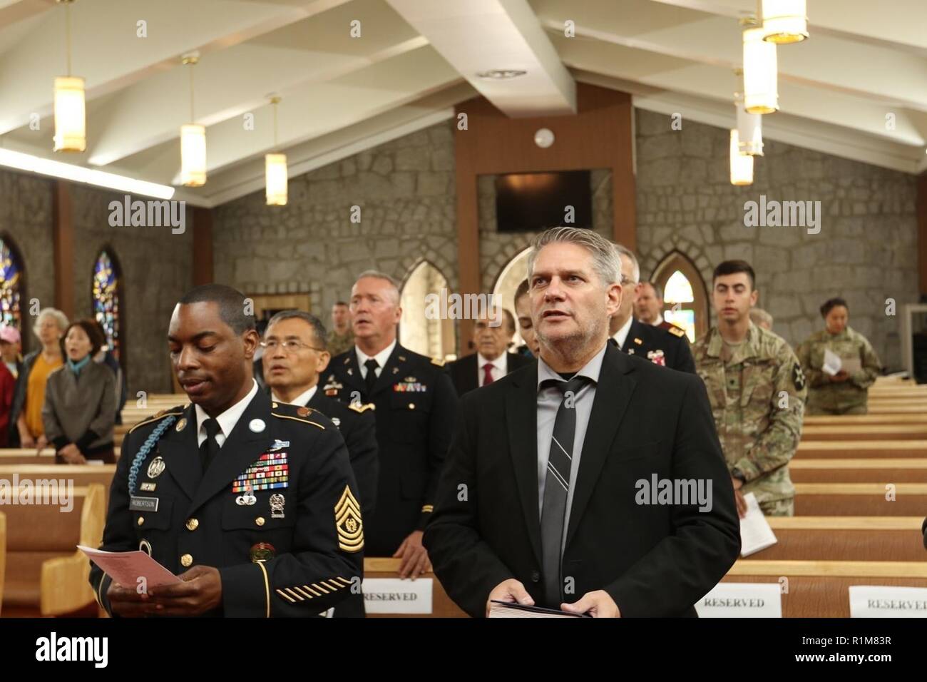 CAMP RED CLOUD, Republic of Korea – Members of the community gather at the Warrior Chapel for ...