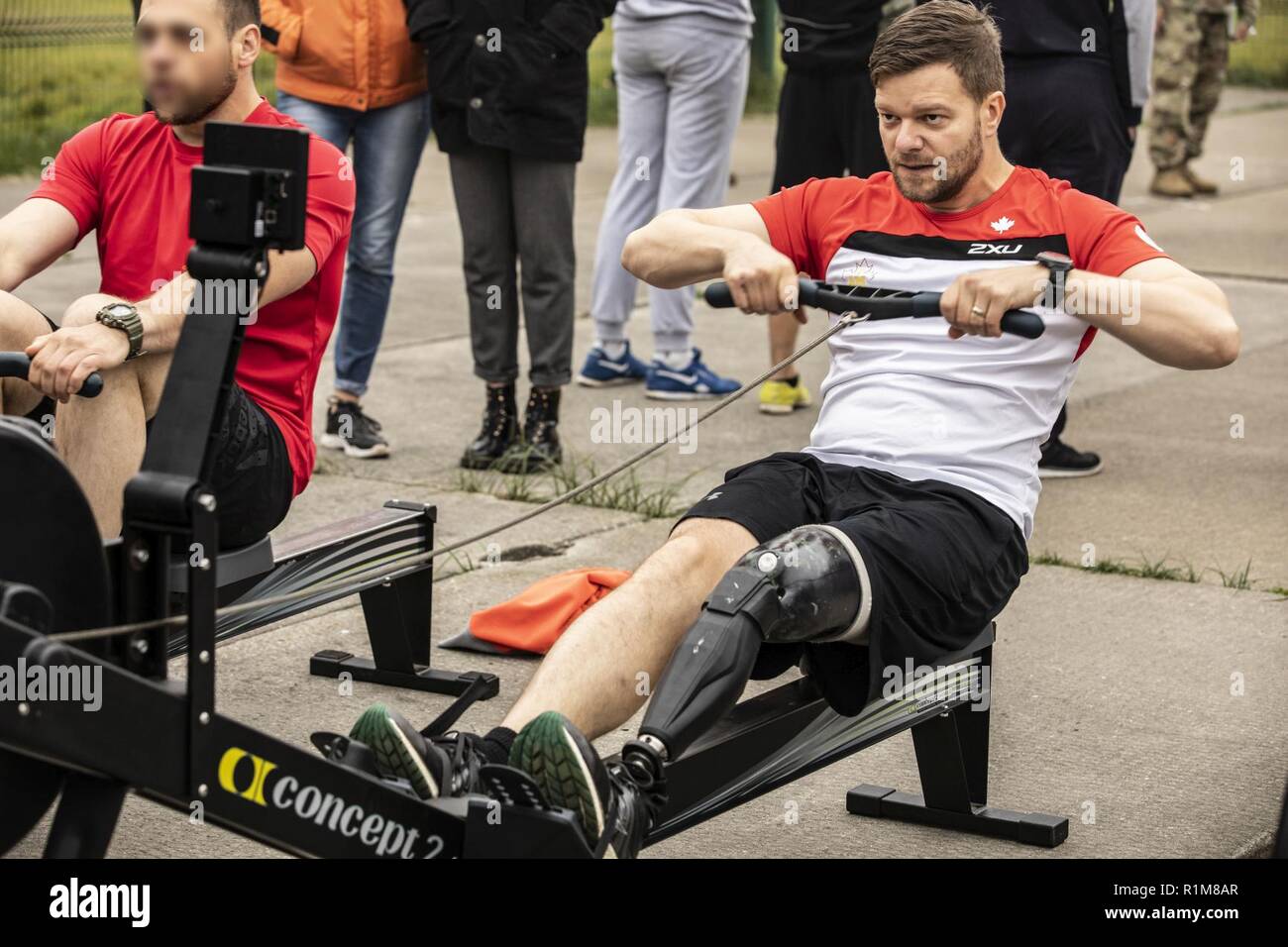 Maj. Simon Mailloux (right) comets in rowing competition during the ...