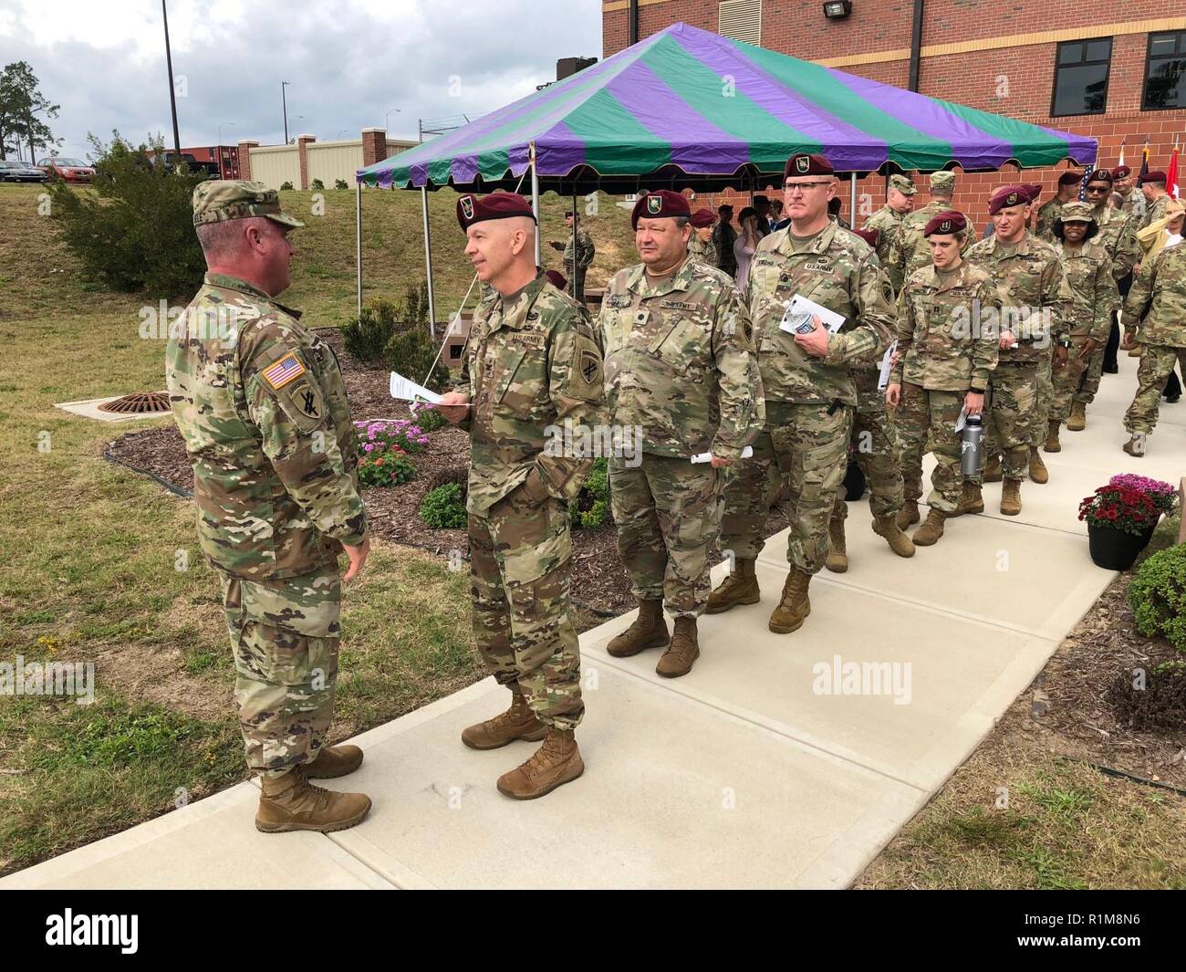 Soldiers line up to congratulate Brig. Gen. Richard Sele, left, United ...