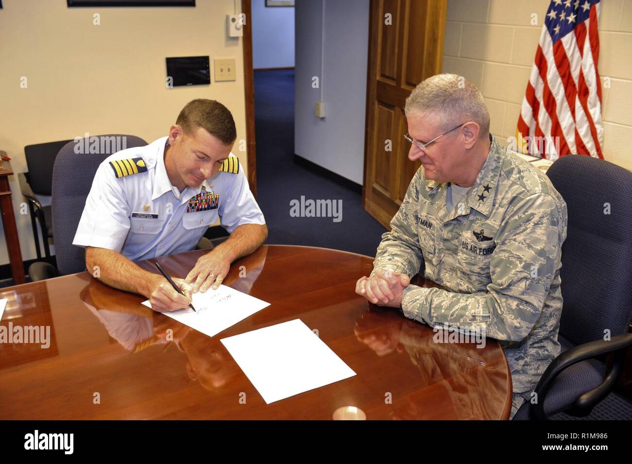 Maj. Gen. Mark E. Bartman (right), Ohio adjutant general, looks on as ...