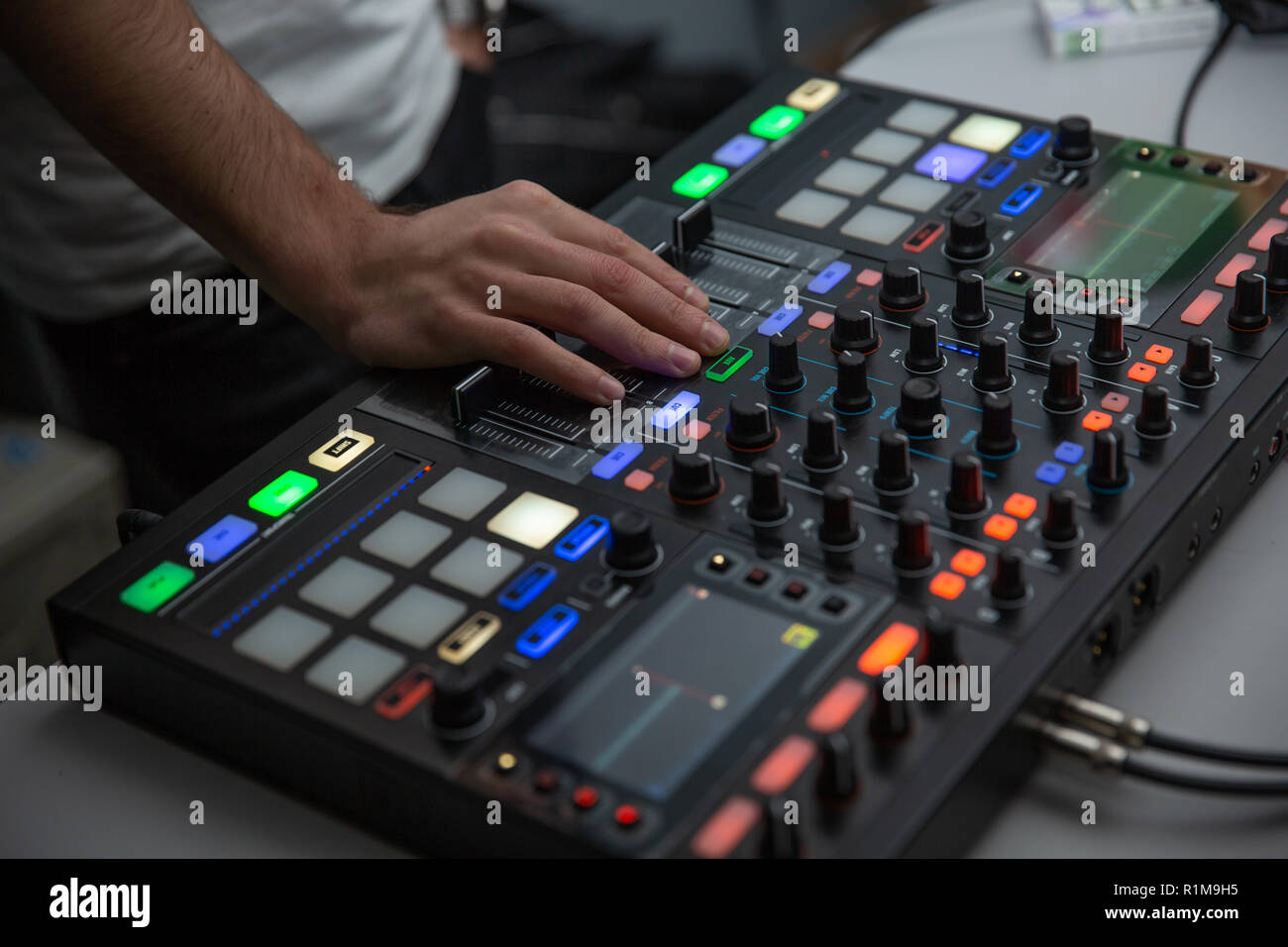 music, technology, people and equipment concept - man using mixing ...