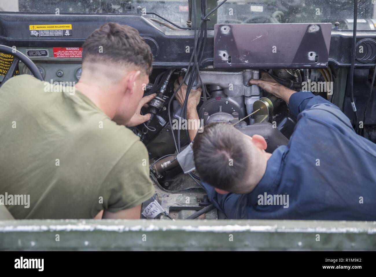 U.S. Marine Corps Pfc. Jaime Ayuso (left), motor vehicle operator, and ...