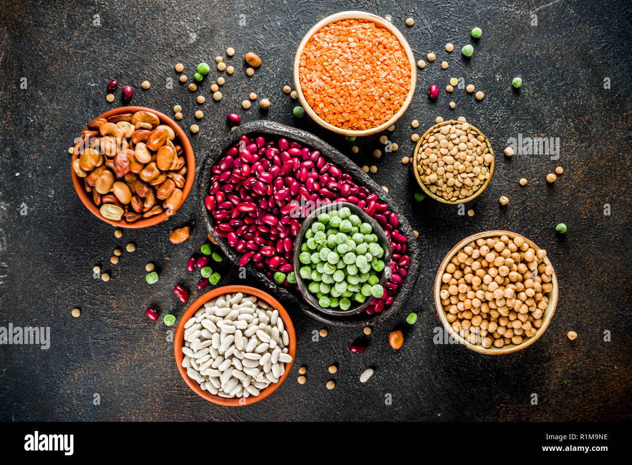 Various assortment of legumes - beans, soy beans, chickpeas, lentils ...