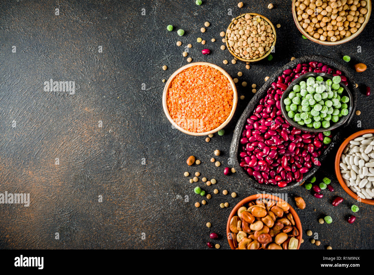 Various assortment of legumes - beans, soy beans, chickpeas, lentils ...