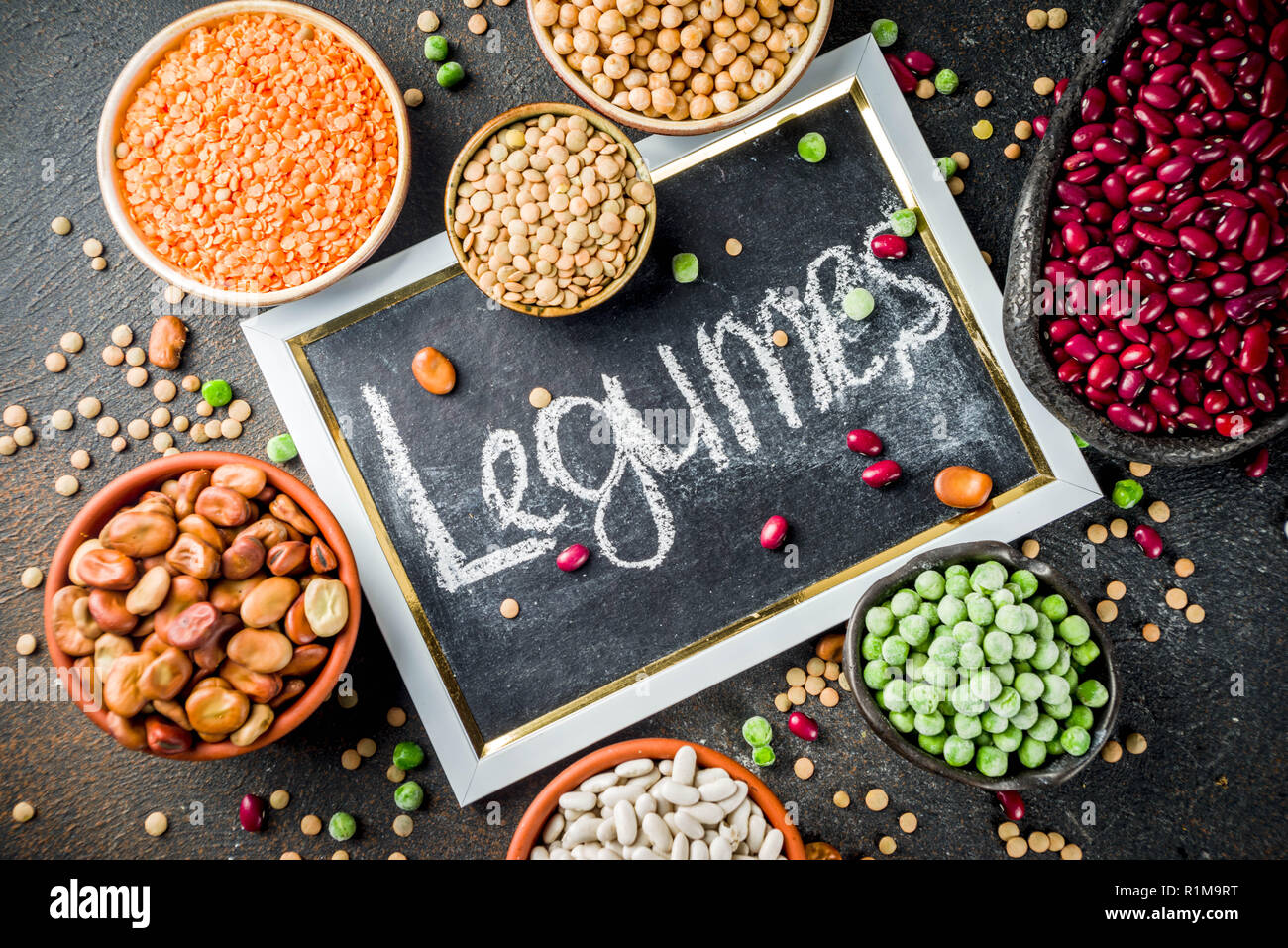 Various assortment of legumes - beans, soy beans, chickpeas, lentils ...