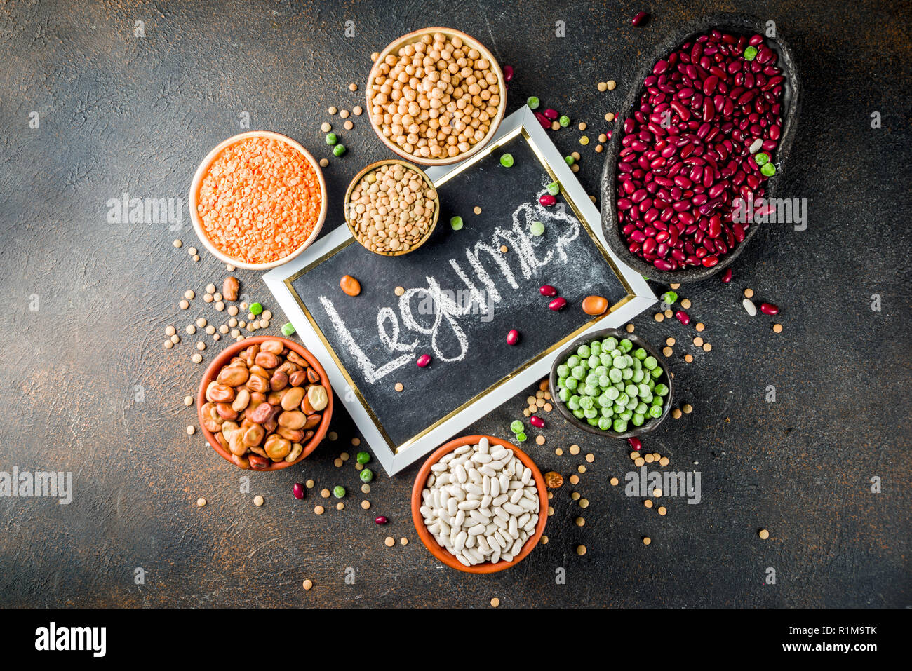 Various assortment of legumes - beans, soy beans, chickpeas, lentils ...