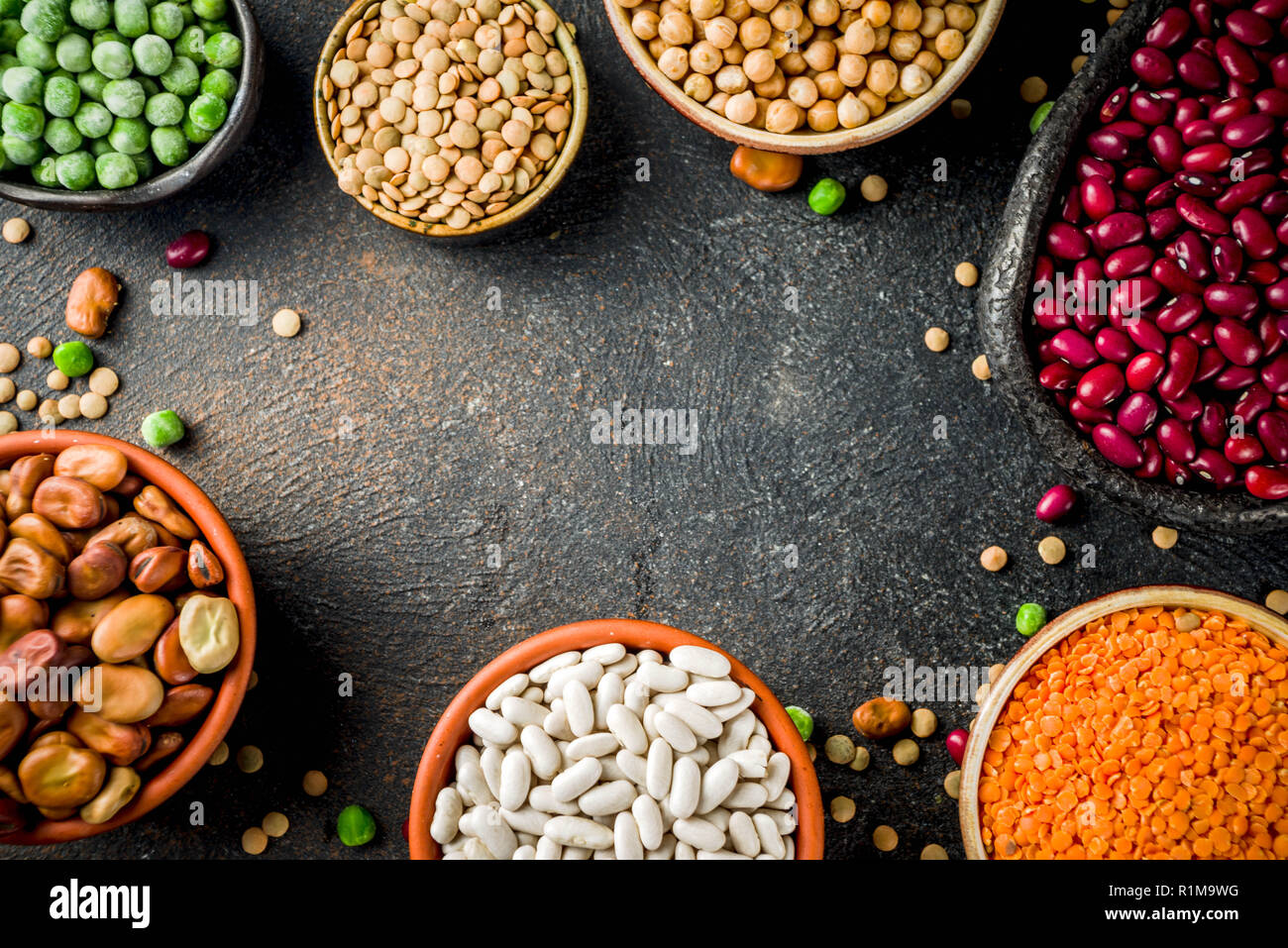 Various assortment of legumes - beans, soy beans, chickpeas, lentils ...