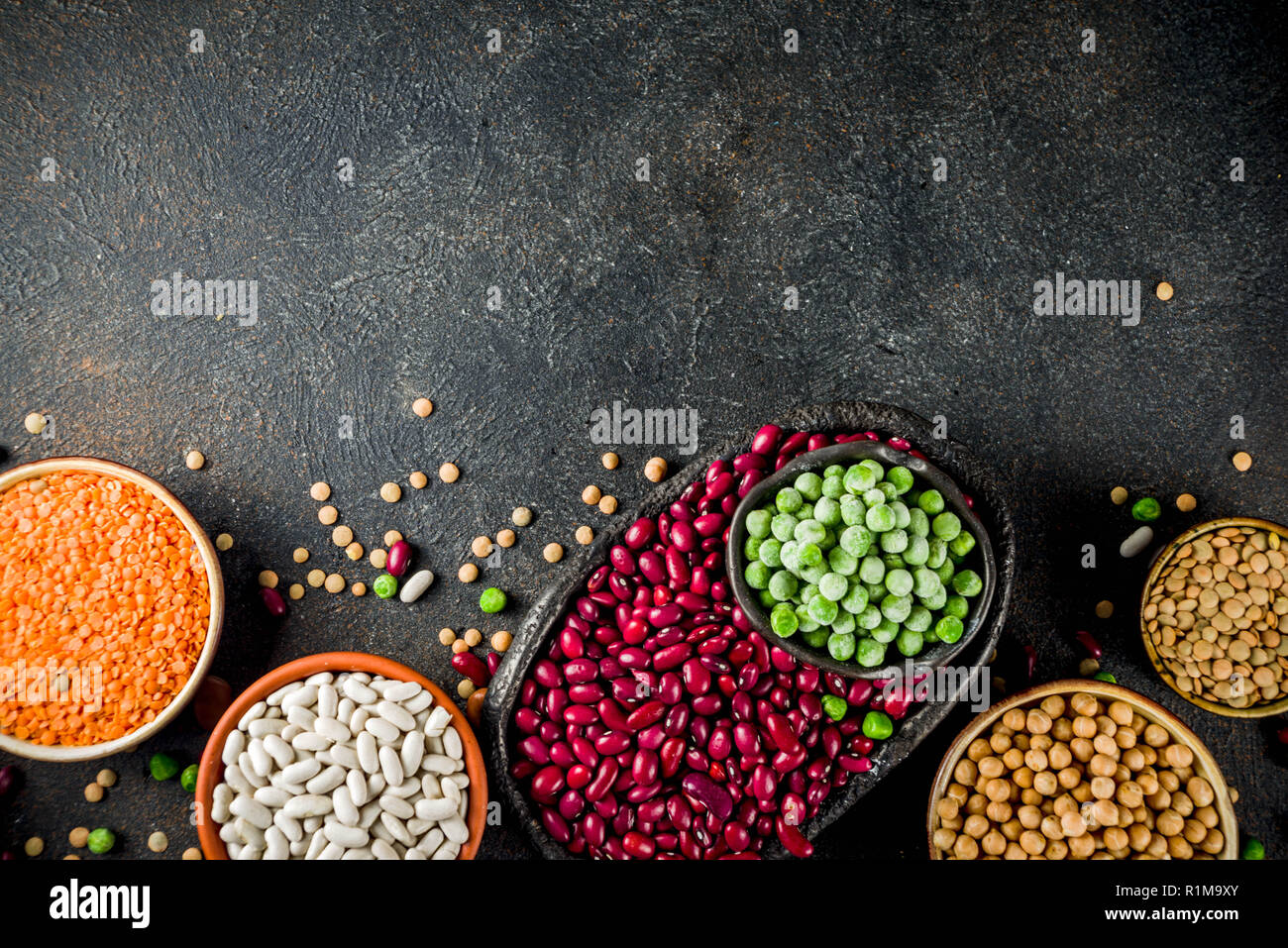 Various assortment of legumes - beans, soy beans, chickpeas, lentils ...